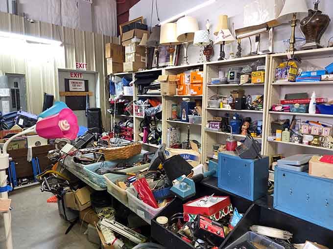 Inside, organized chaos reigns supreme with lamps and collectibles stacked high like an attic that actually wants visitors.