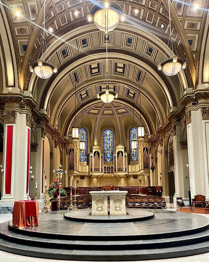 That barrel-vaulted ceiling draws your eyes heavenward through geometric patterns toward stained glass and pipe organs.