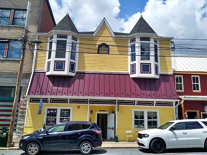 This yellow Victorian building with twin turrets looks like it escaped from a storybook and decided to stay.