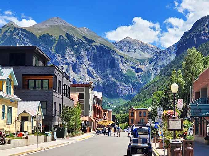 Those dramatic cliffs rise behind colorful buildings, reminding you that nature always gets top billing in this town.