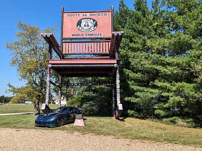 The bright red chair towers over passing cars, inviting travelers to stop and appreciate supersized Americana.