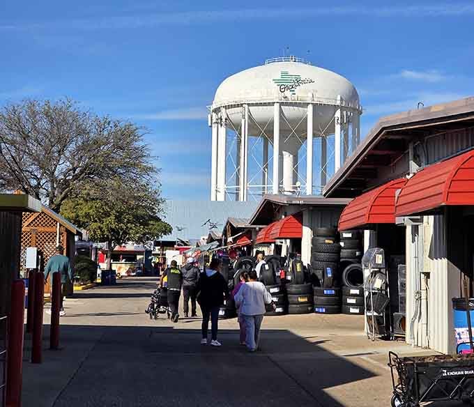 The town water tower stands sentinel over red-roofed market buildings where generations of shoppers have discovered deals worth bragging about.