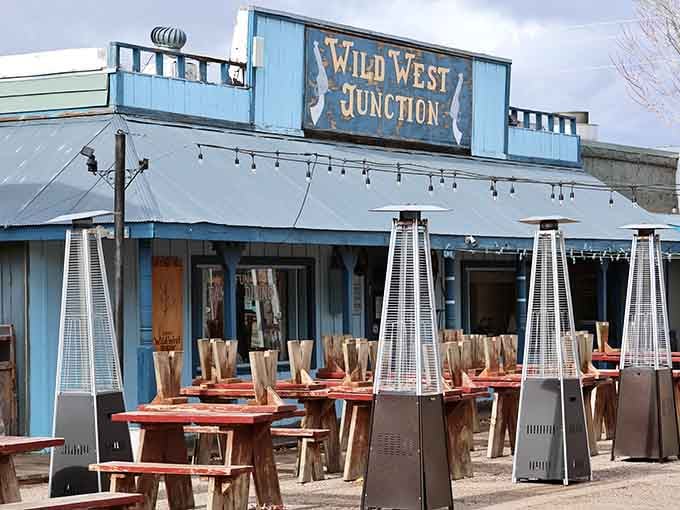 String lights twinkle above wooden tables where modern comfort meets authentic Western hospitality and mountain breezes.