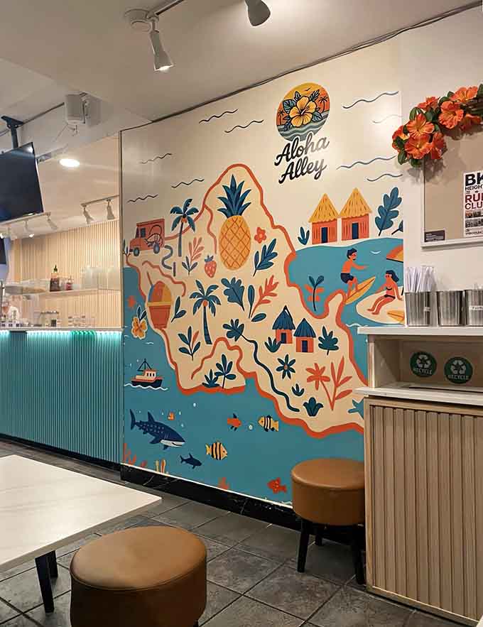A colorful island mural featuring pineapples and palm trees reminds you exactly where your food's inspiration comes from.