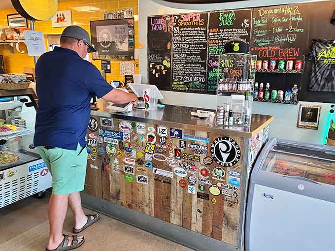 Sticker-covered counters tell stories of happy customers who couldn't resist leaving their mark on this beloved spot.
