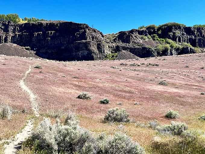 The trail winds through terrain that looks suspiciously like Mars, if Mars had better hiking conditions and waterfalls.
