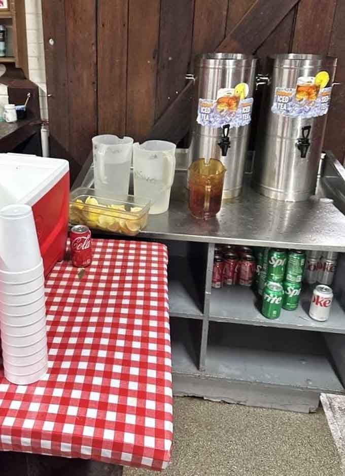 Sweet tea dispensers flanked by cold sodas and that classic red-and-white gingham pattern scream authentic Southern hospitality at its finest.