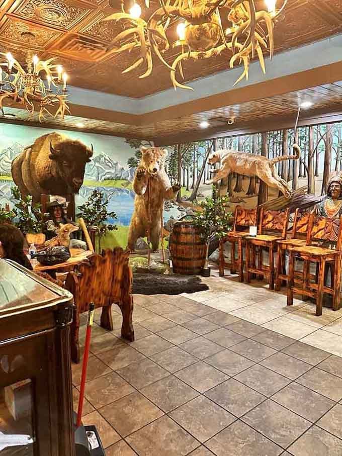 The buffet area features taxidermy and Western murals, creating an immersive dining experience throughout the restaurant.