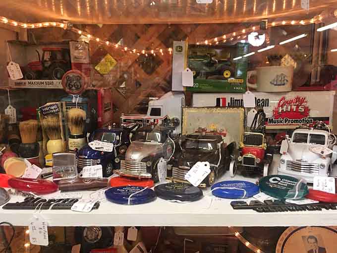 Miniature trucks and vintage collectibles arranged like a tiny museum dedicated to America's automotive love affair and nostalgia.