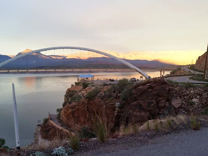 That bridge spanning Roosevelt Lake at golden hour proves engineers can be artists when they try hard enough.