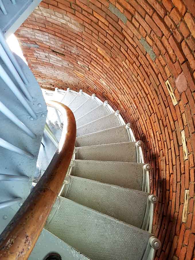 Spiral stairs curve upward through aged brick, each step bringing you closer to breathtaking panoramic views.