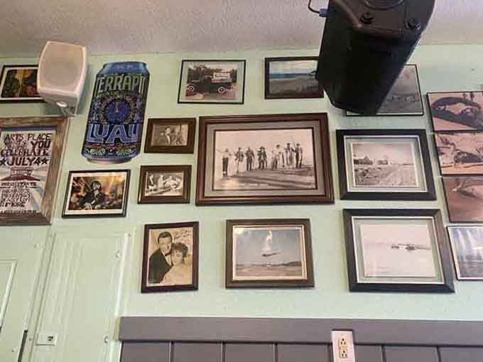 Vintage photographs and local memorabilia cover the walls, telling stories of beach life and simpler times gone by.