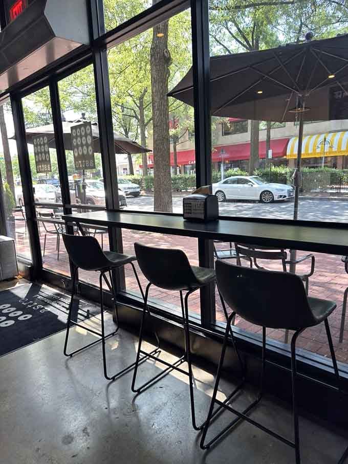 Window seats offering prime people-watching real estate while you contemplate your next doughnut, because one is never enough here.