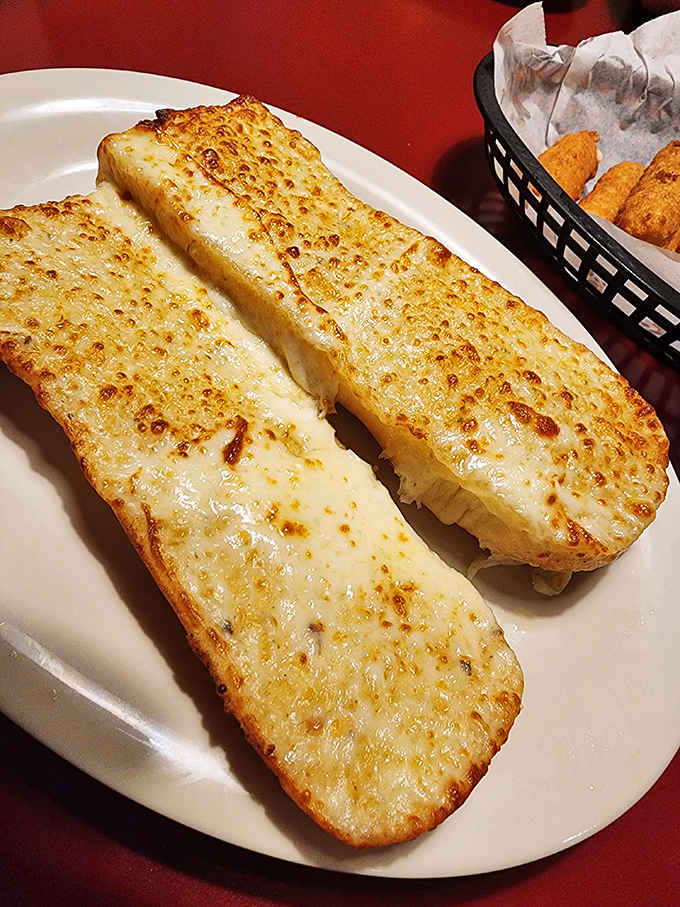 Garlic bread toasted to golden perfection, because sometimes the simplest things in life are also the most satisfying.