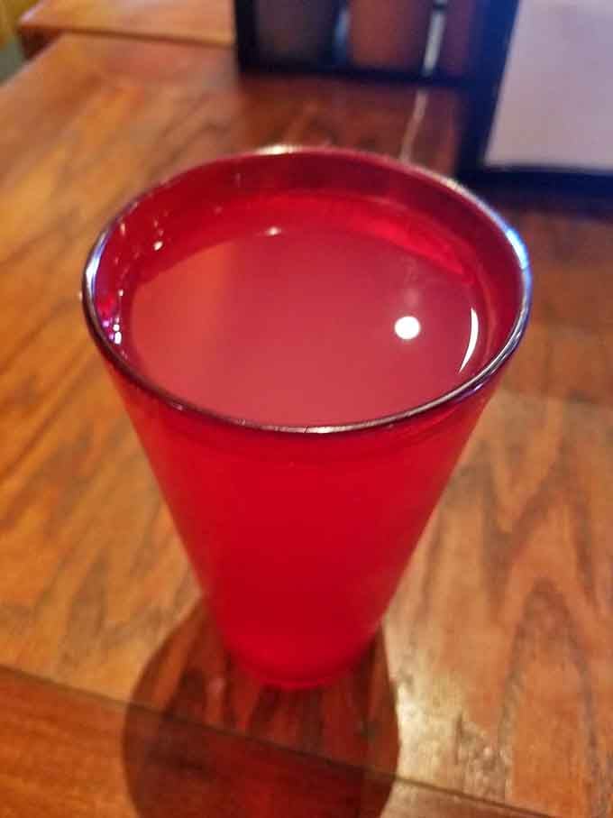 Bright pink lemonade in a plastic cup might seem humble, but it's the perfect sweet-tart companion to smoky richness.