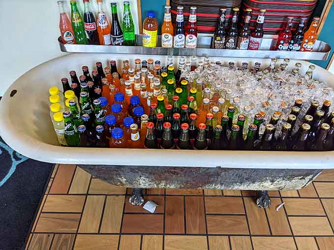 That vintage bathtub filled with cold beverages is peak Americana meets practical genius in the best way.