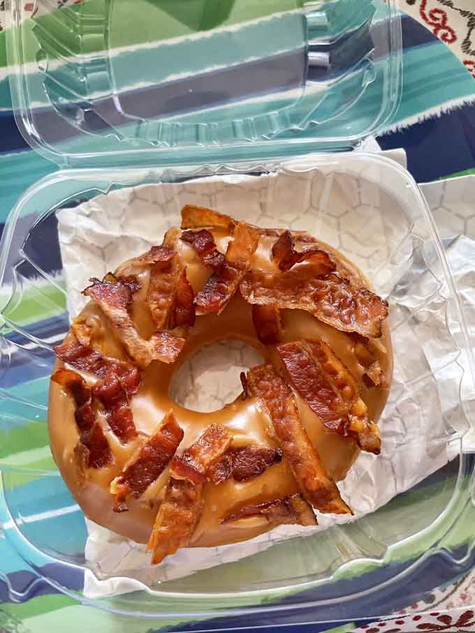 Maple bacon on a donut: because sometimes breakfast needs to have an identity crisis, and we're all better for it.