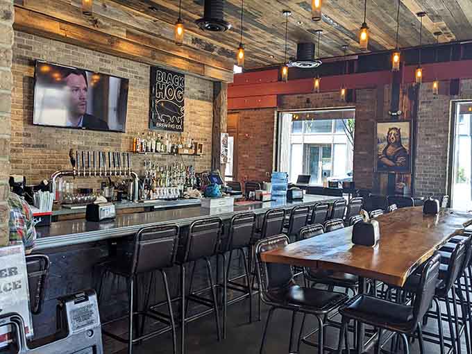 The bar area features exposed brick and plenty of seating for those who prefer their ribs with a cold beverage.