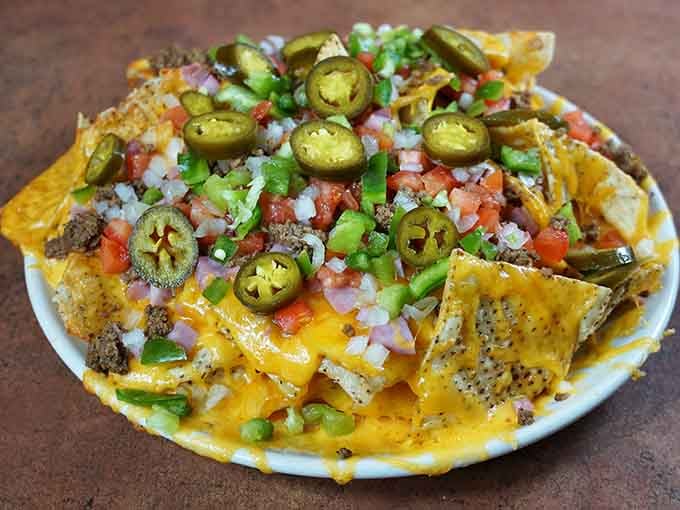 These loaded nachos are piled so high, you'll need a strategy and possibly a forklift to finish them.