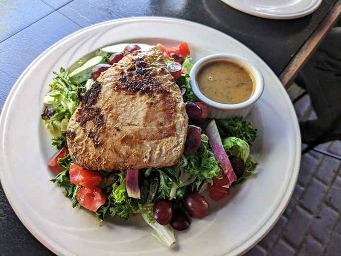 Seared tuna atop fresh greens transforms a simple salad into something worthy of your Instagram feed.