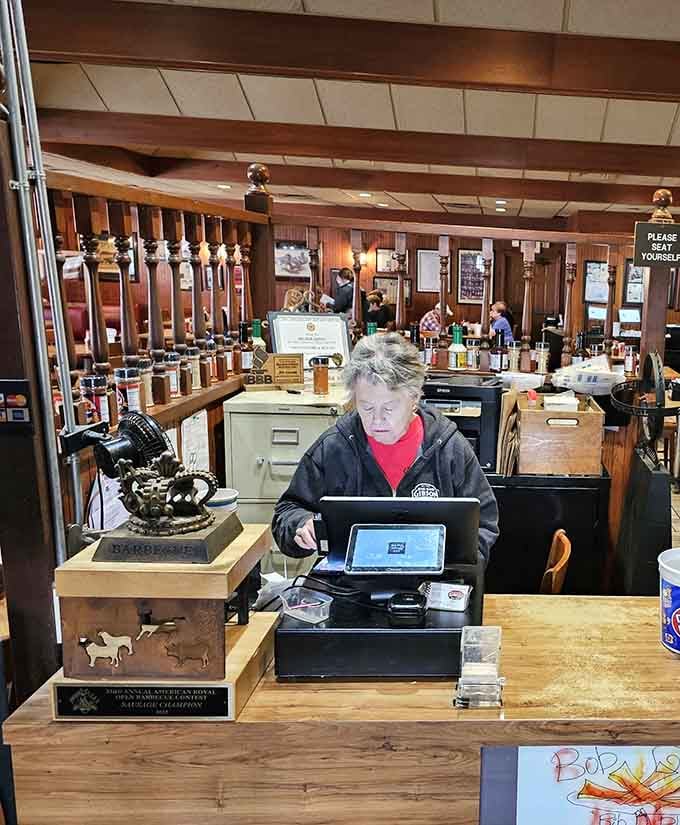 Behind that counter, decades of barbecue wisdom and trophies tell their own delicious story.