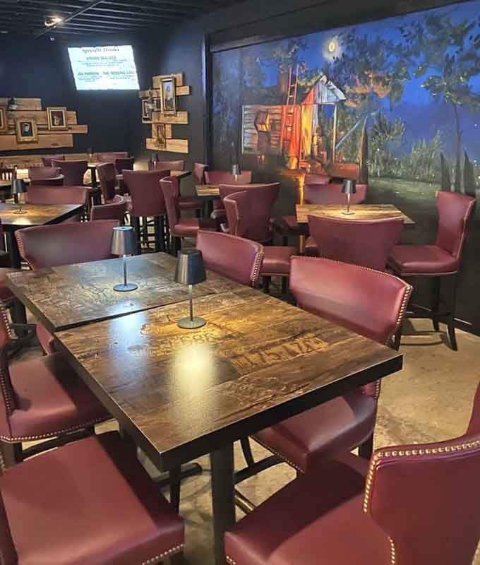 Leather booths and artistic murals create the rare barbecue joint where comfort meets culture beautifully.