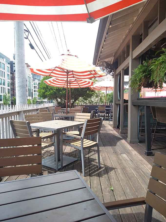 A patio with striped umbrellas where you can pretend you're dining seaside in the city.
