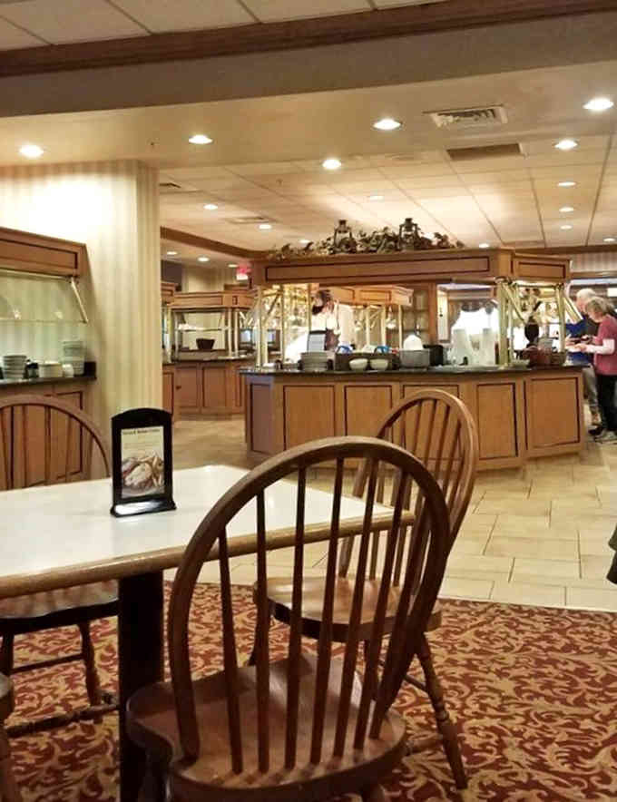 Windsor chairs and patterned carpet create that comfortable dining room where calories magically don't count at all.