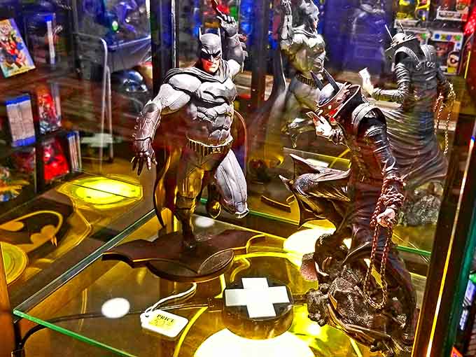 Display cases showcase collectible figures that would make any Batman fan's heart skip several excited beats.