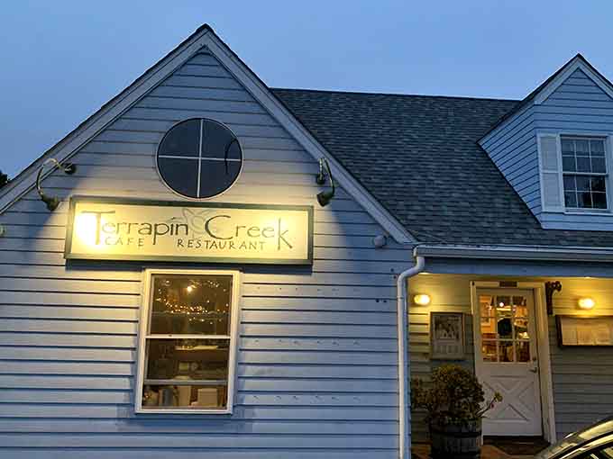 Charming cottage exterior hiding serious culinary talent, like Clark Kent but with better clam chowder.