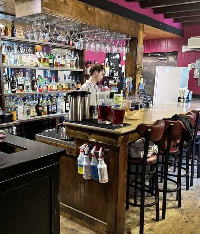The bar area where skilled hands craft cocktails that transport you straight to Bourbon Street, no plane ticket required.