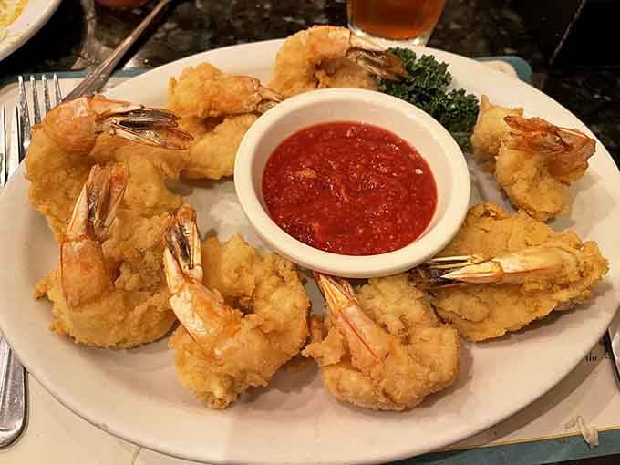 Golden fried shrimp arranged like edible jewelry, each piece a crispy testament to the art of proper frying.