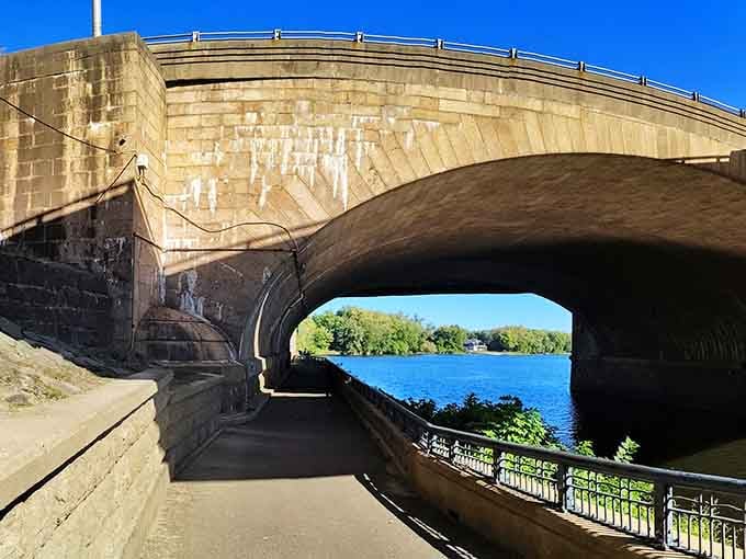 Walking beneath the bridge reveals the impressive scale and craftsmanship that went into this engineering marvel.