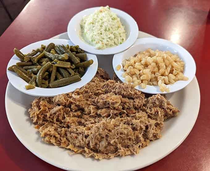 Pulled pork barbecue with string beans, coleslaw, and corn: this is what comfort looks like on a plate.