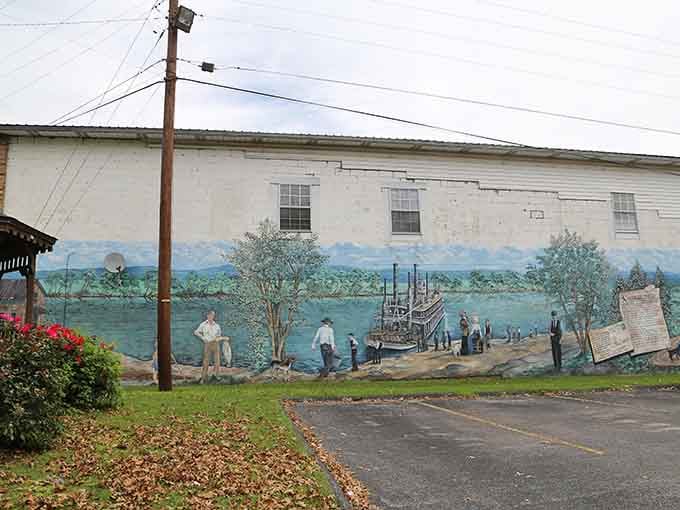 This mural captures Burkesville's river heritage, turning a plain wall into a time machine you can photograph.