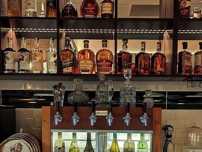 Those bourbon bottles lined up like soldiers, ready to serve their country, or at least your Old Fashioned craving tonight.