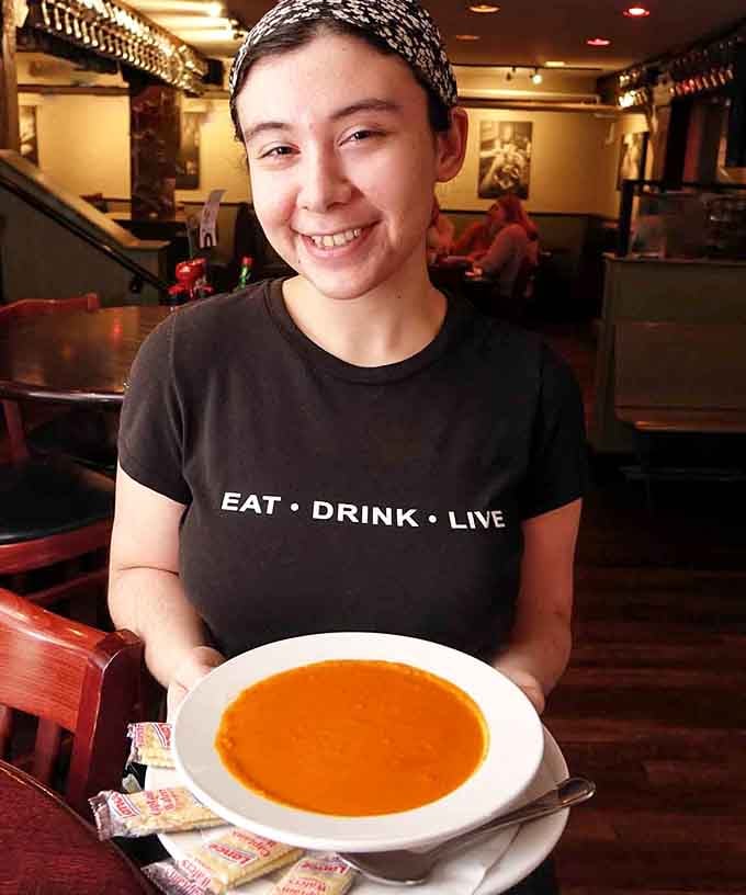 That "Eat. Drink. Live." shirt isn't just a uniform, it's basically the restaurant's entire mission statement in three words.