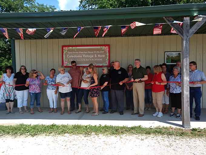 Ribbon-cutting ceremonies prove small towns still celebrate community milestones with genuine enthusiasm and homemade cookies.