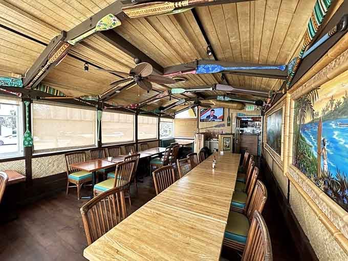 The dining room balances tropical vibes with comfortable seating, proving you don't need sand between your toes to feel beachy.