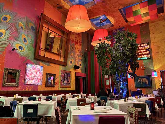 Peacock murals and colorful lampshades create an atmosphere where even your salad feels like it's attending a fabulous party.