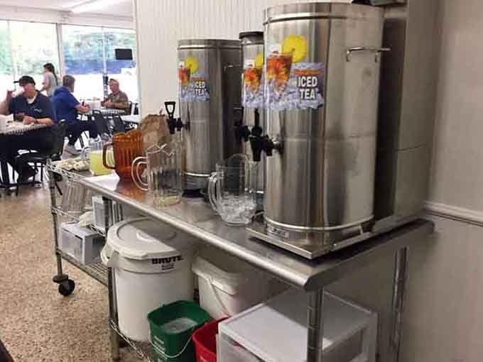 Sweet tea and lemonade dispensers standing ready to quench thirsts like Southern hospitality in stainless steel form.