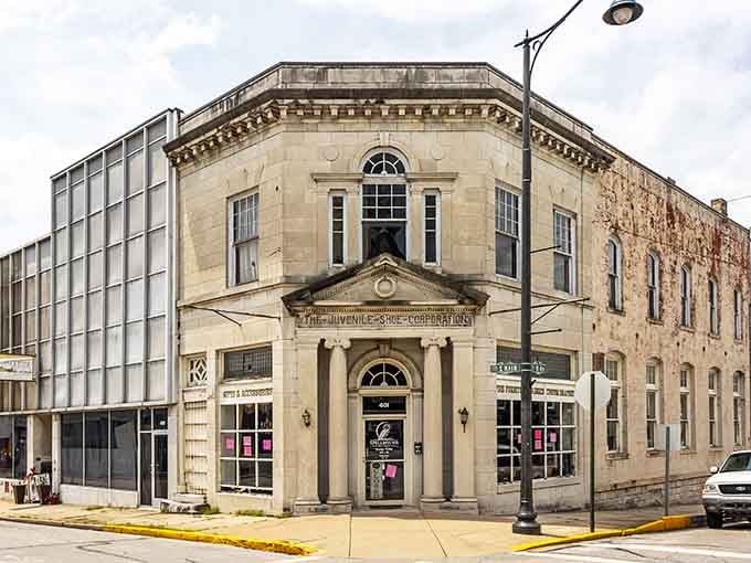 The Juvenile Shoe Corporation building stands proud, its ornate stonework reminding us when even factories were built beautifully.