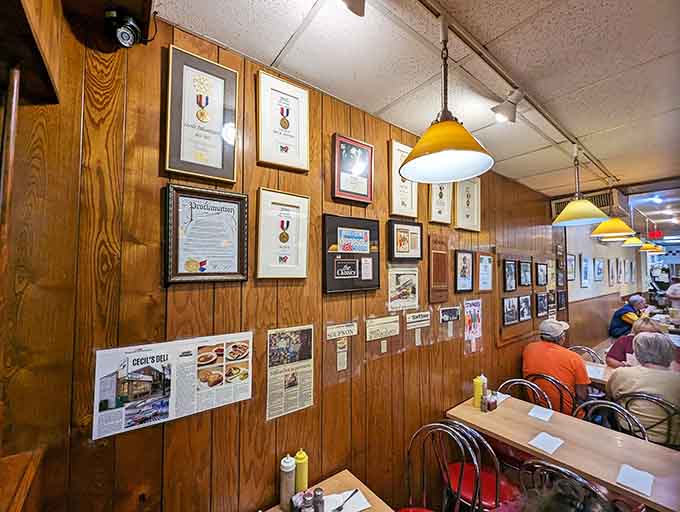 Awards and accolades line the walls like trophies, silent testimony to decades of sandwich excellence and community devotion that never wavers.