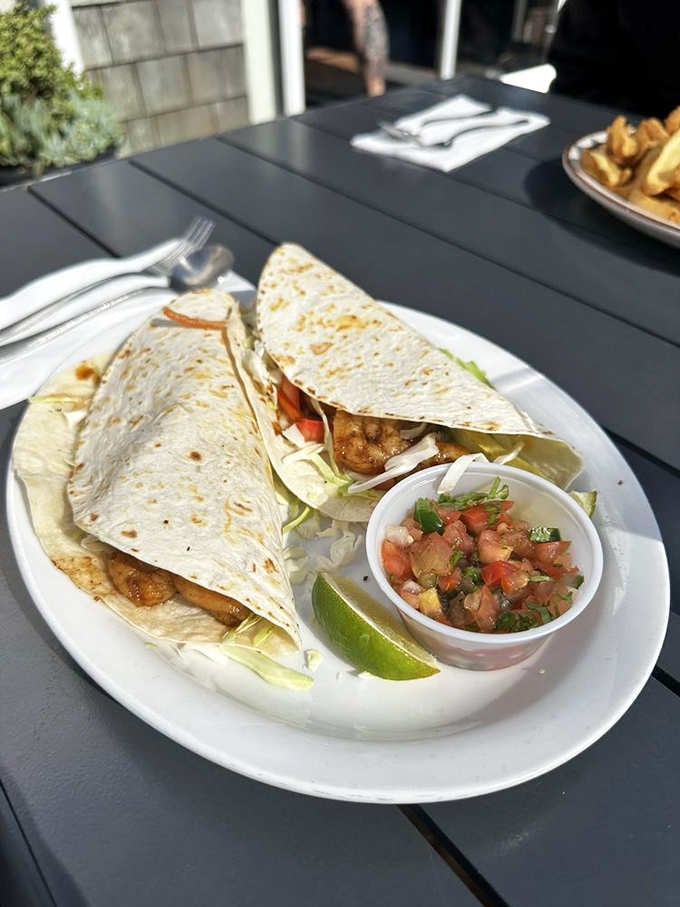 Shrimp tacos stuffed with fresh seafood prove that good things come in folded flour packages.
