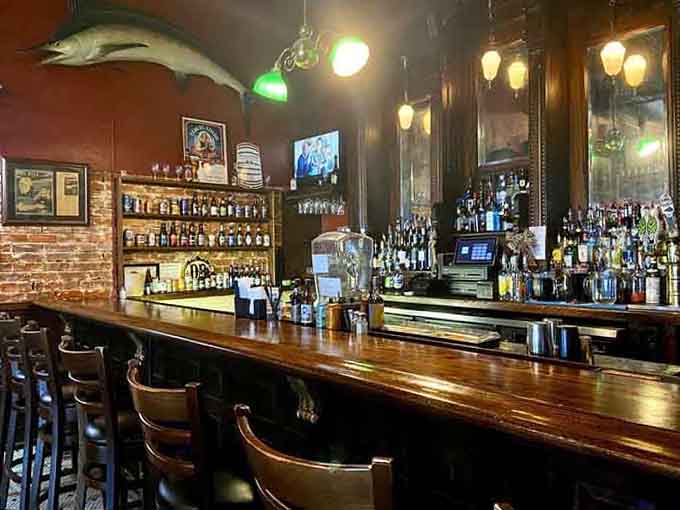 A well-stocked bar with maritime touches overhead reminds you that good drinks and good times go hand in hand here.