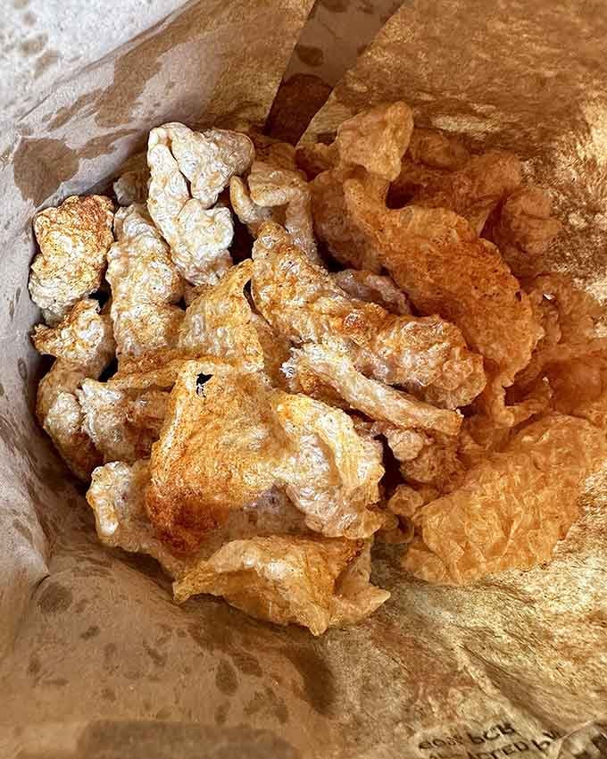 Pork rinds that crunch louder than your teenager's music, proving that simple snacks can be absolutely addictive.