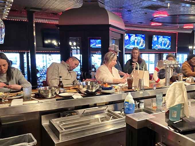 Counter seating offers front-row views of the culinary action, dinner and a show included free.