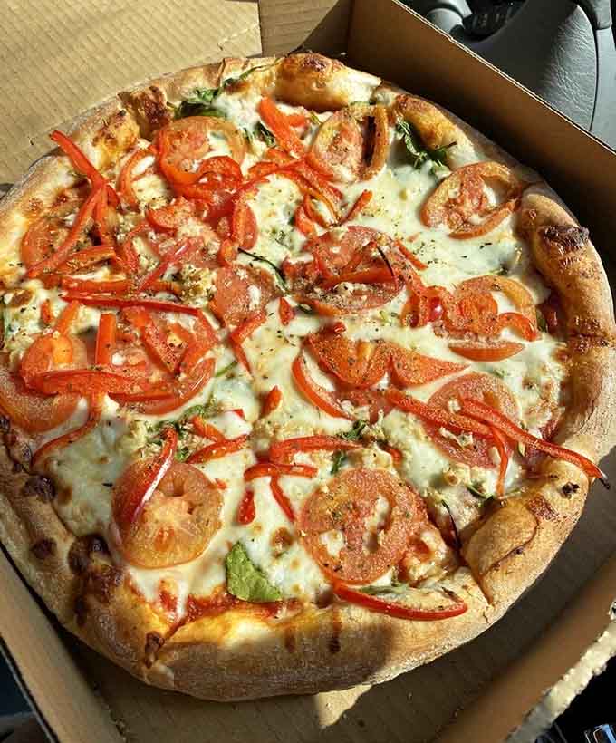 Fresh tomatoes and roasted red peppers on a perfectly blistered crust&mdash;this is pizza with a California attitude.