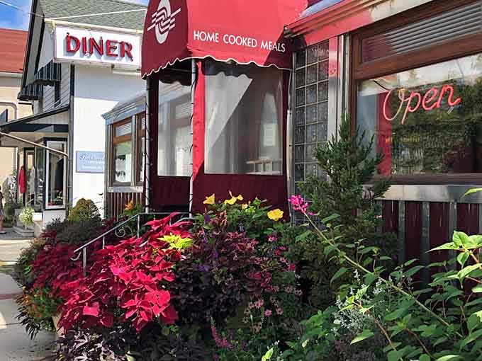 Those vibrant flowers practically beg you to stop in, and that "Home Cooked Meals" promise seals the deal.