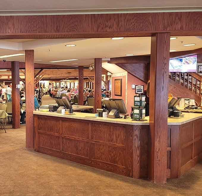 That welcoming payment counter with its beautiful woodwork is where your incredible meal journey officially begins and reluctantly ends.